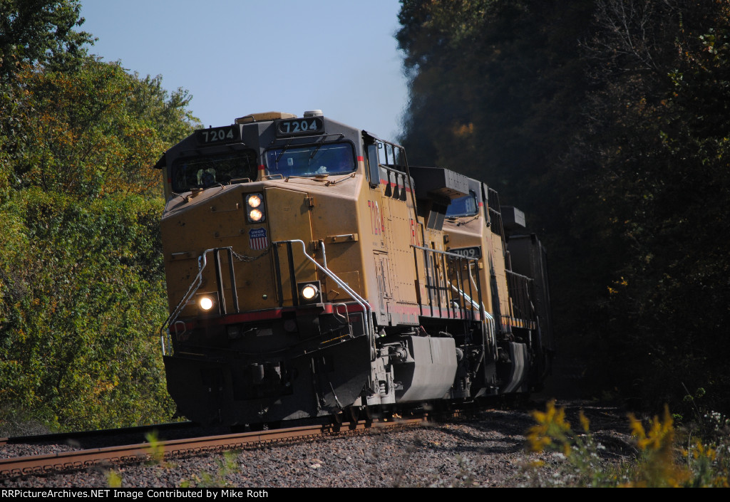Union Pacific 7204 is in charge westbound.